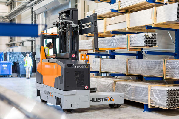 Sideloader forklifts for long loads in narrow aisles | HUBTEX
