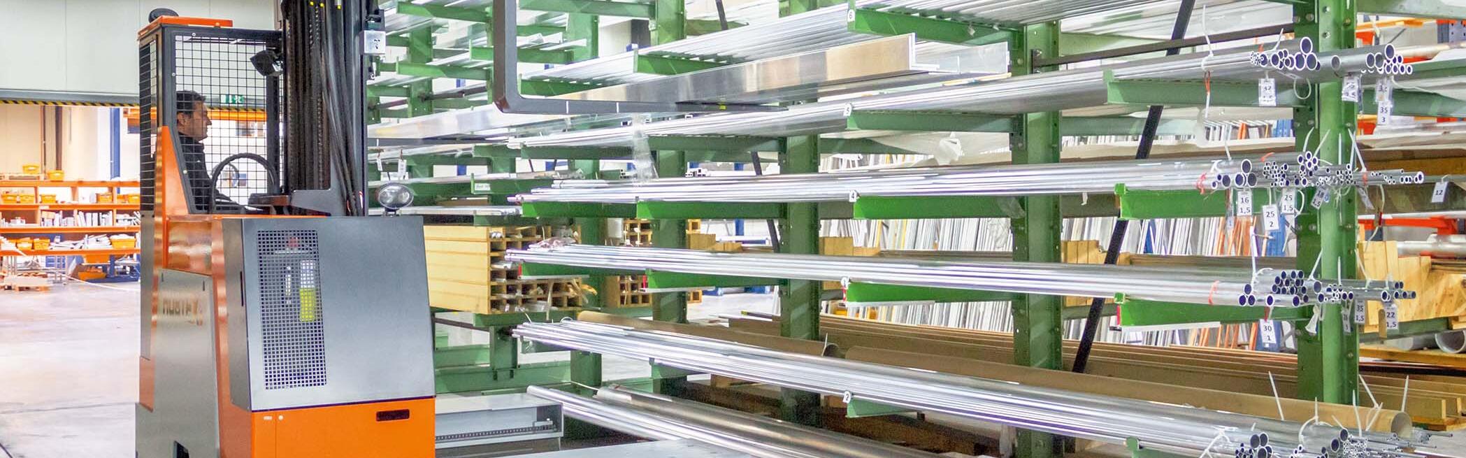 Sideloader forklifts for long loads in narrow aisles | HUBTEX